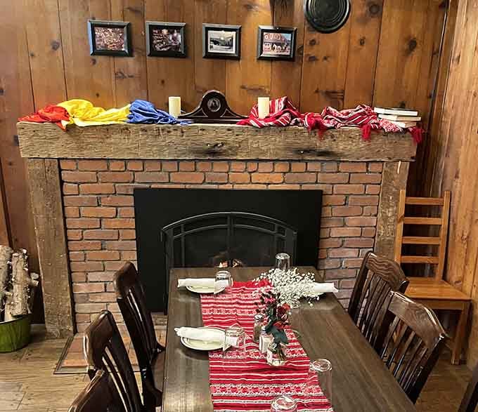 That brick fireplace adds warmth and charm, making every meal feel like a celebration at someone's welcoming mountain home.