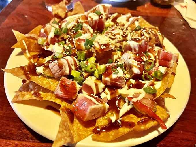 Tuna nachos transform bar food into an art form, with each chip delivering a perfect bite of ocean-fresh flavor.