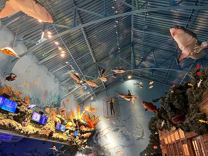 Fish sculptures swim through the air above diners, creating an upside-down aquarium that somehow makes perfect sense.