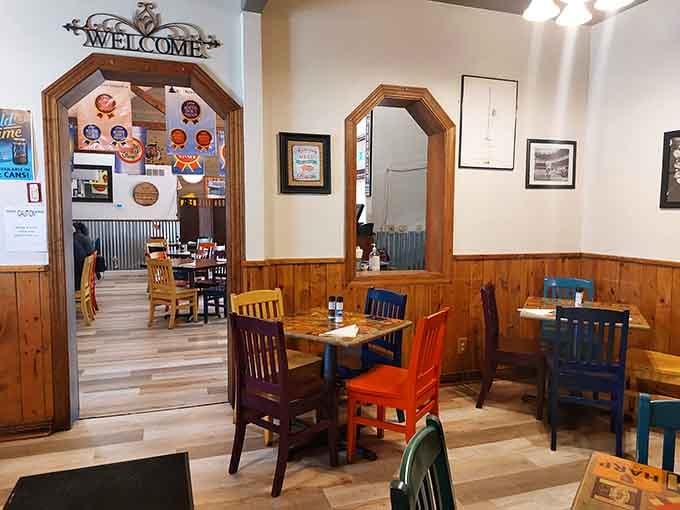 That Welcome sign and those mismatched chairs create the kind of cozy atmosphere where strangers become friends over ribs.