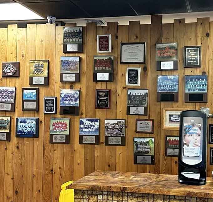 The wall of local sports teams tells the story of a restaurant deeply woven into community fabric&mdash;where memories are made between bites of perfect burgers.