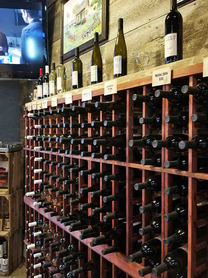 A wine wall displaying bottles like treasured memories, each one waiting for the right moment to shine.