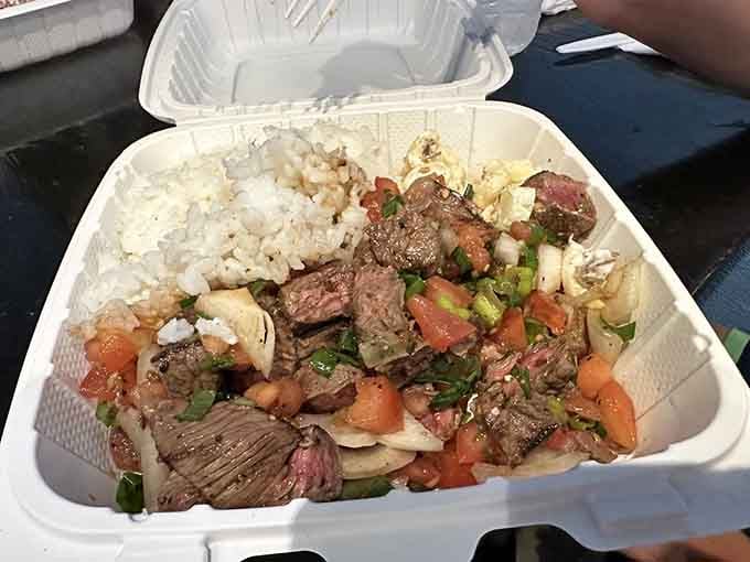 This beef dish with fresh tomatoes and onions is what happens when island ingredients decide to throw a party on your plate.