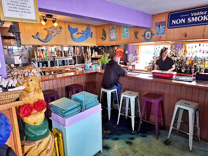 The bar area: where locals share fishing tales that grow taller with each round, surrounded by maritime decor that's actually seen some sea.