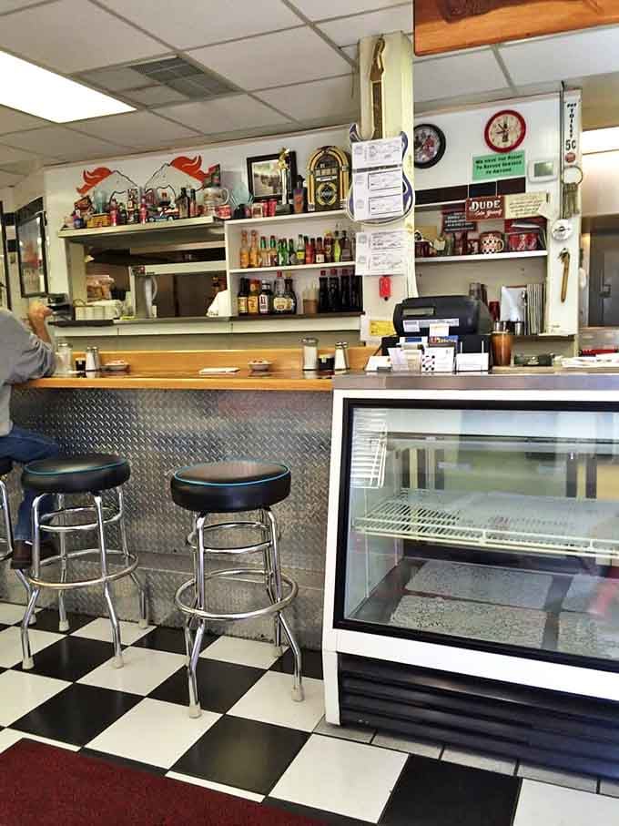 The counter where breakfast dreams come true, complete with classic diner stools that have supported countless happy customers.