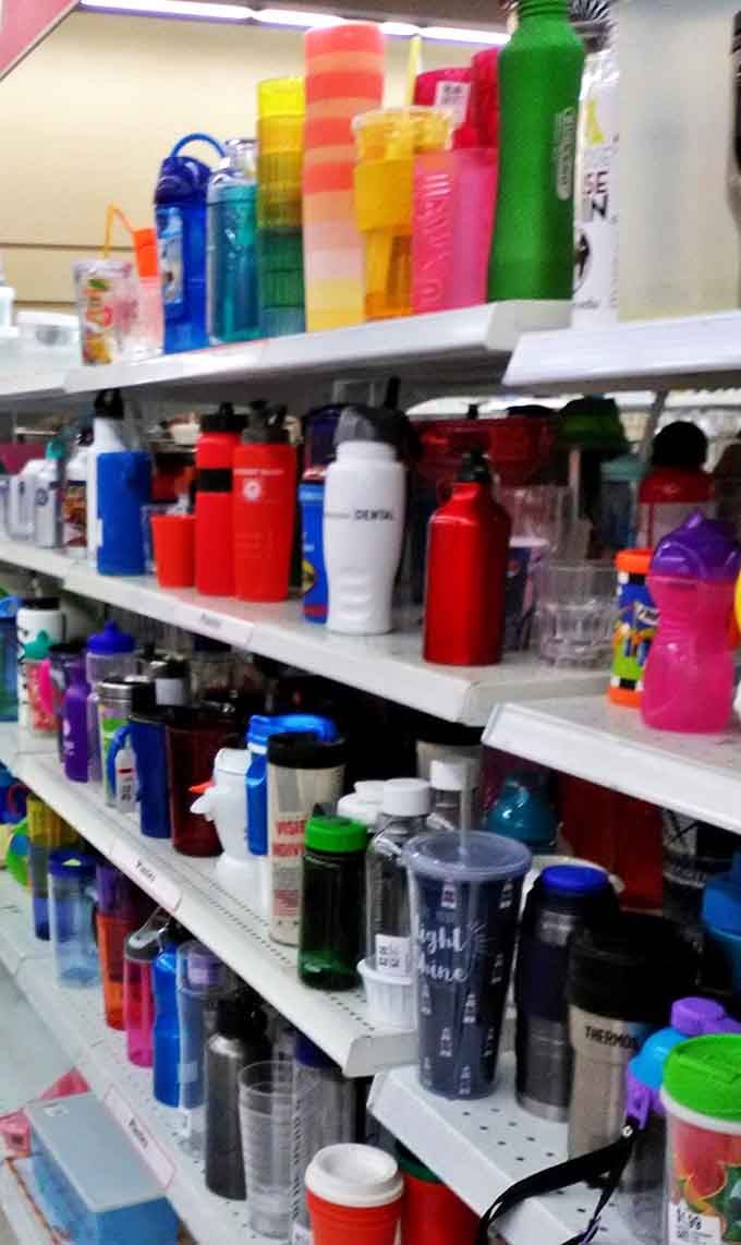 A rainbow arsenal of water bottles and travel mugs &ndash; because one person's decluttering mission becomes another's hydration solution.