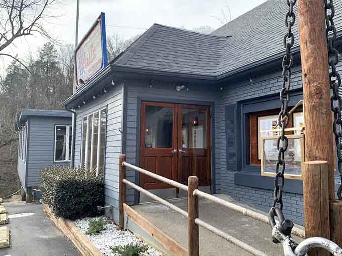The welcoming entrance with its chain railings hints at the riverside charm waiting just beyond those doors.