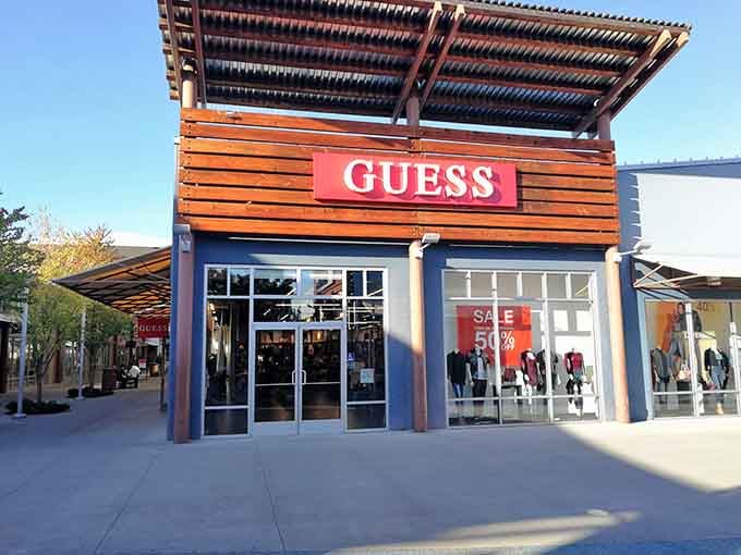 Guess offers 50% off window displays that make your wallet whisper, "Go on, you deserve this" as you walk by.