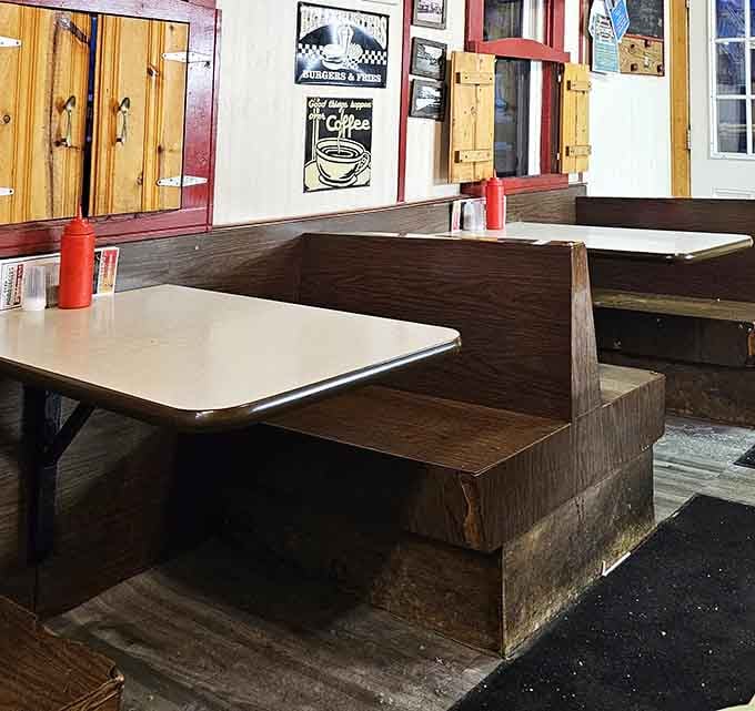 Red squeeze bottles and wooden booths – the universal language of "you're about to eat something honest and delicious."