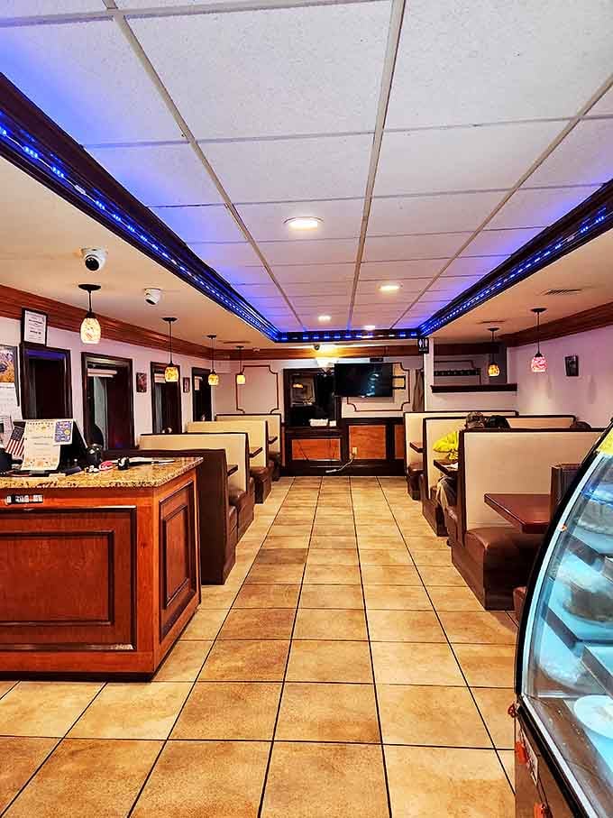 Blue accent lighting casts a cool glow over comfortable booths, creating that distinctive diner atmosphere where time seems to slow down just enough.