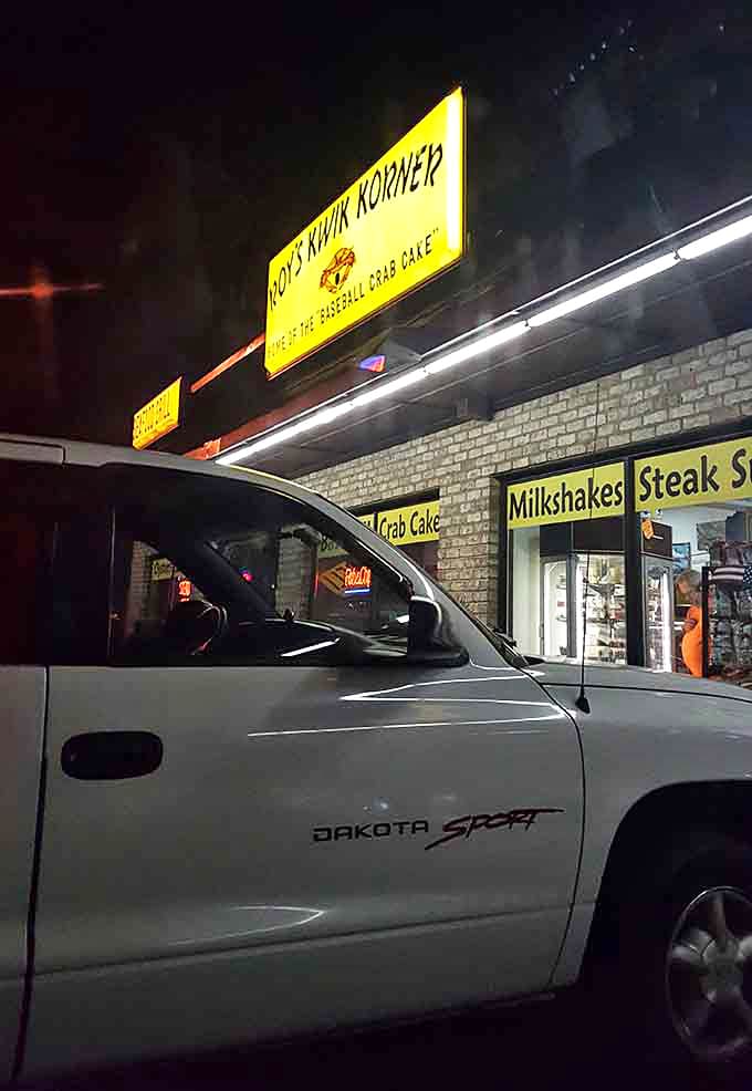 Even at night, that yellow sign beckons like a lighthouse, guiding hungry travelers to safe harbor and spectacular crab cakes.