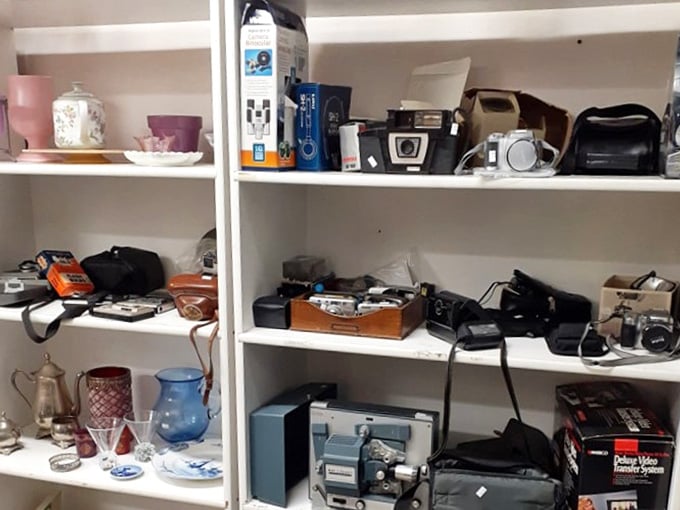 Vintage cameras and electronics create a museum-like display of technological evolution&mdash;from Polaroids to digital, all waiting for their comeback moment.