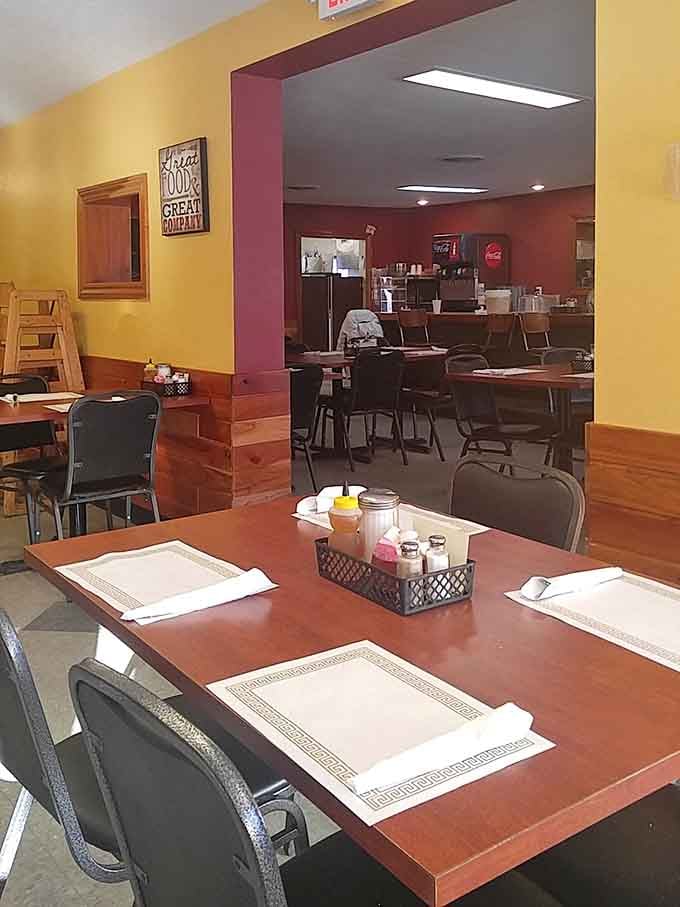 The dining room's warm wood tones and paper placemats tell you immediately: this is a place where food matters more than pretense.
