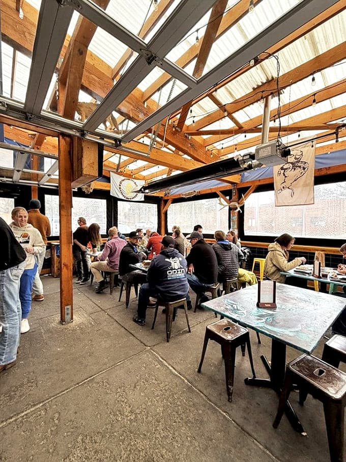 The covered patio where strangers become friends, united by their mutual appreciation for wrapped breakfast perfection.