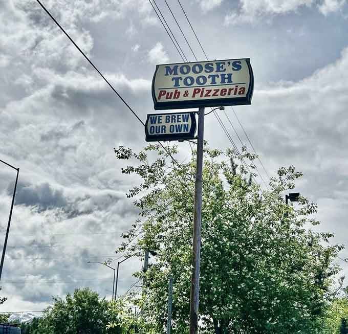 "We Brew Our Own" isn't just a sign&mdash;it's a promise. Against Alaska's dramatic sky, it's practically a billboard for liquid happiness.