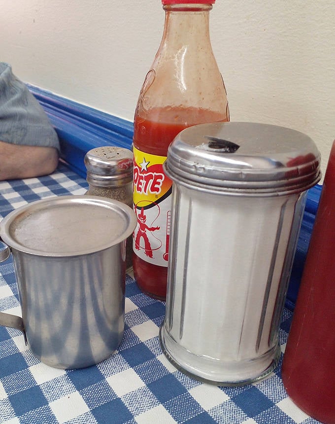The holy trinity of diner condiments: sugar, salt, and ketchup&mdash;the supporting actors that never steal the scene but enhance every bite.