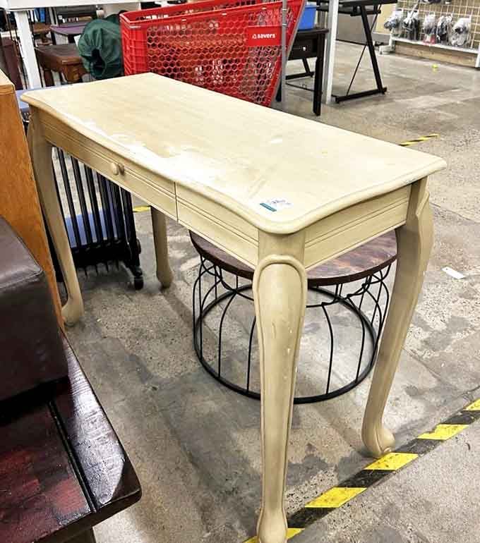 Elegant curves and timeless design make this console table a testament to thrifting's golden rule: patience rewards with beauty.