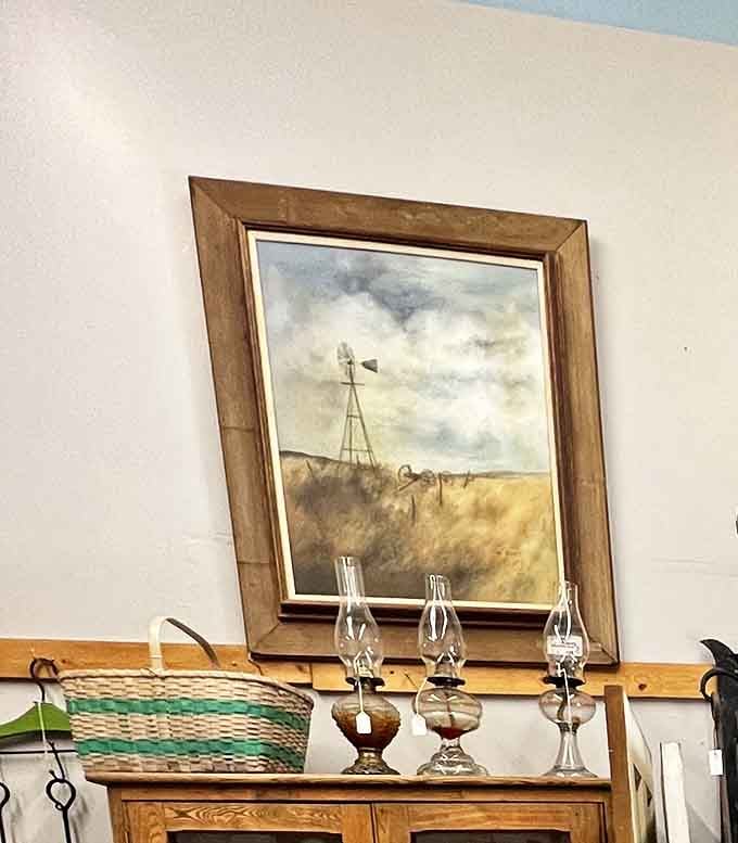 Prairie nostalgia captured in brushstrokes and gilded frame&mdash;the kind of artwork that makes you suddenly crave homemade bread and simpler times.