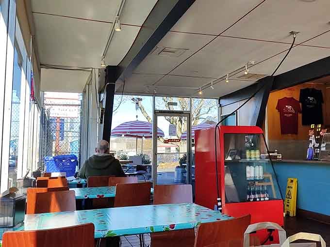 The open layout and colorful seating create an inviting atmosphere where everyone feels right at home.