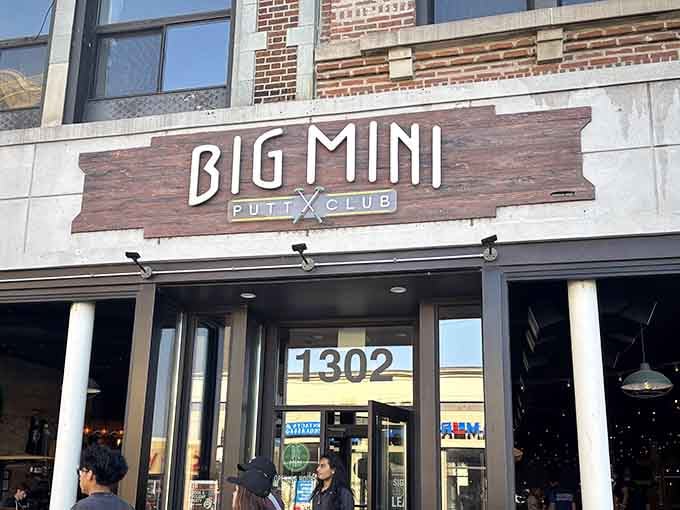 Big Mini's bold signage promises the delightful contradiction of serious fun on a glow-in-the-dark putting green inside.