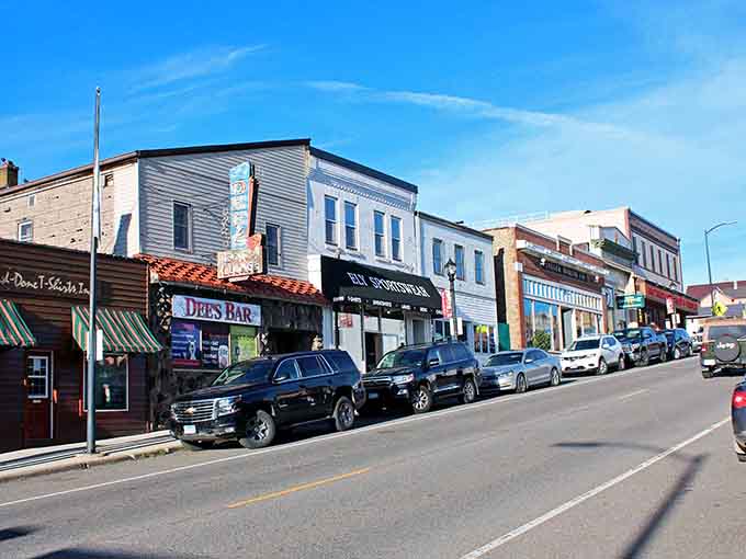 Storefronts mix old and new styles seamlessly, proving that progress and preservation can absolutely dance together beautifully.
