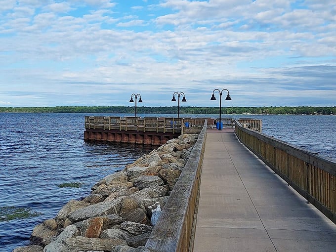 The pier stretches into calm waters under endless blue skies, inviting long walks and quiet moments of reflection.