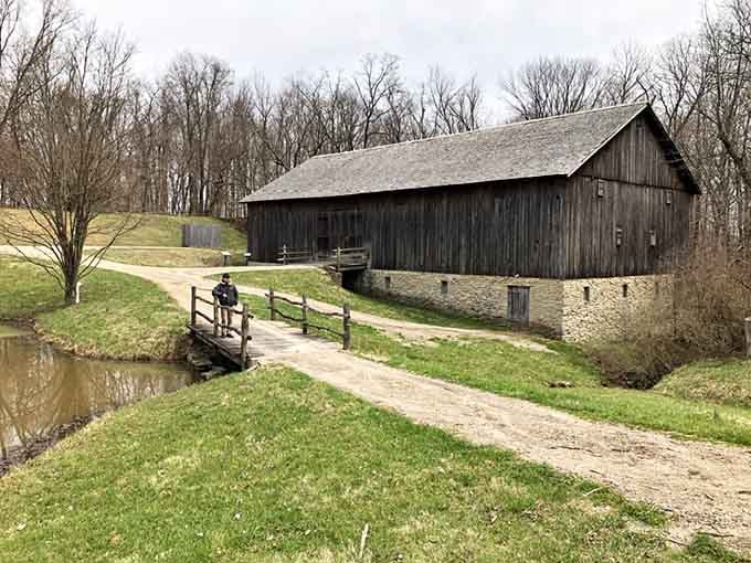 The historic barn sits by a peaceful pond, showing the agricultural side of this political powerhouse estate.