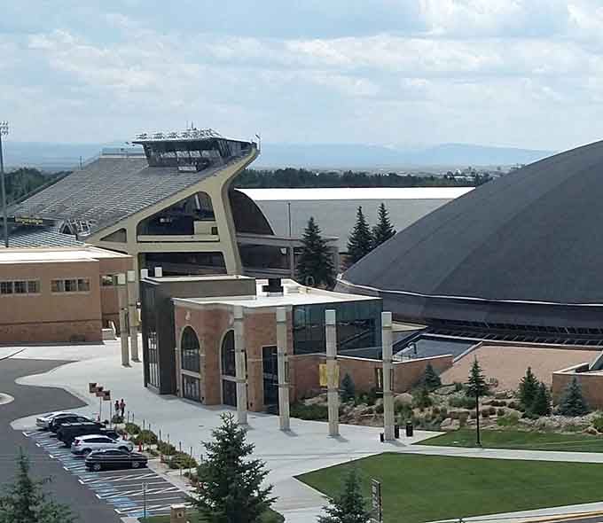 The University of Wyoming's athletic complex combines modern architecture with mountain views. Learning and touchdowns with altitude adjustment included.