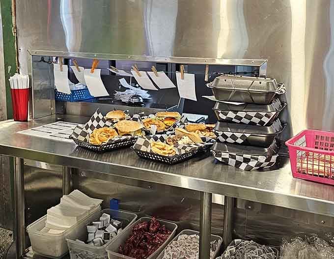 Behind-the-scenes peek at burgers being assembled with care, because good diner food requires attention to every detail.