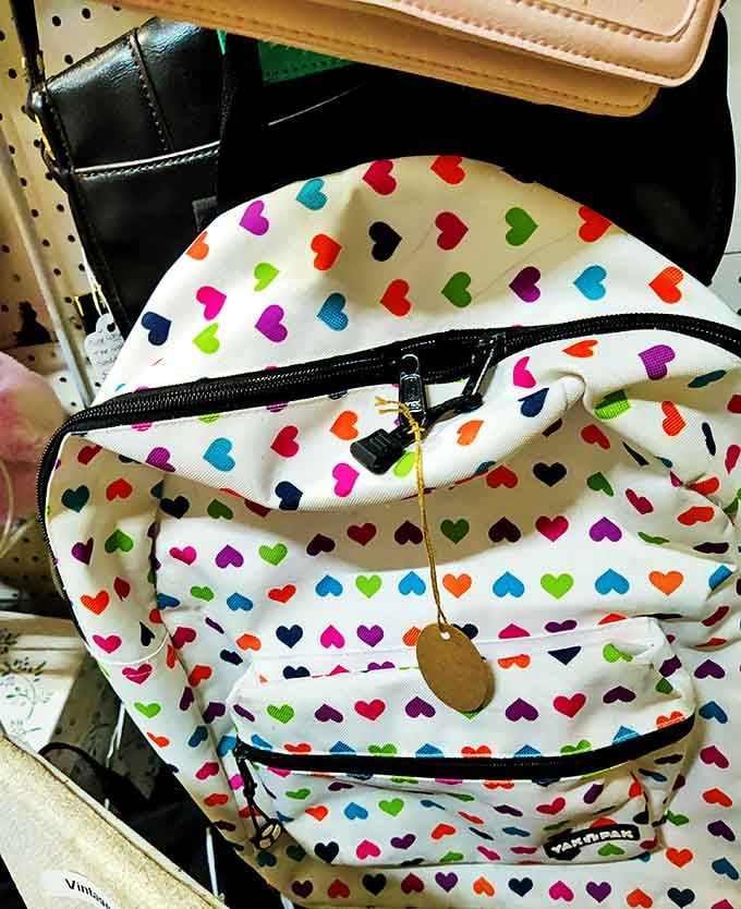 Heart-patterned backpack that screams "I'm practical AND fun!" &ndash; the fashion statement your inner teenager still wants to make.