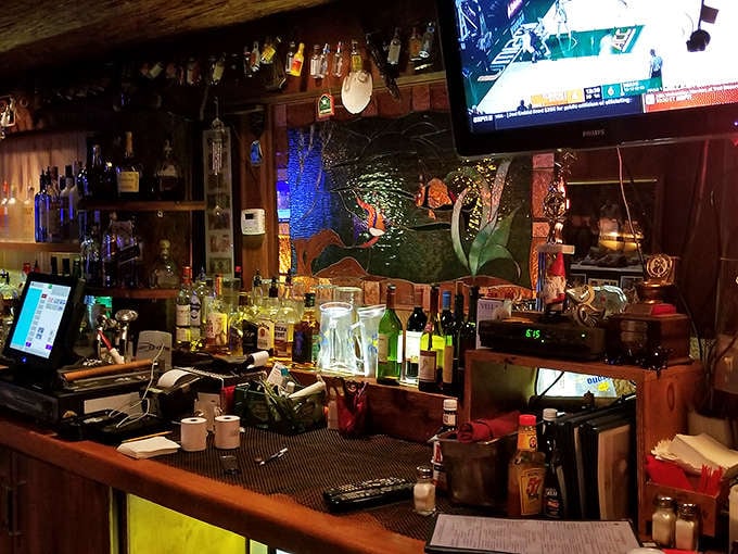 The well-stocked bar stands ready to complement your meal with whatever libation might enhance those flavors of land and sea.
