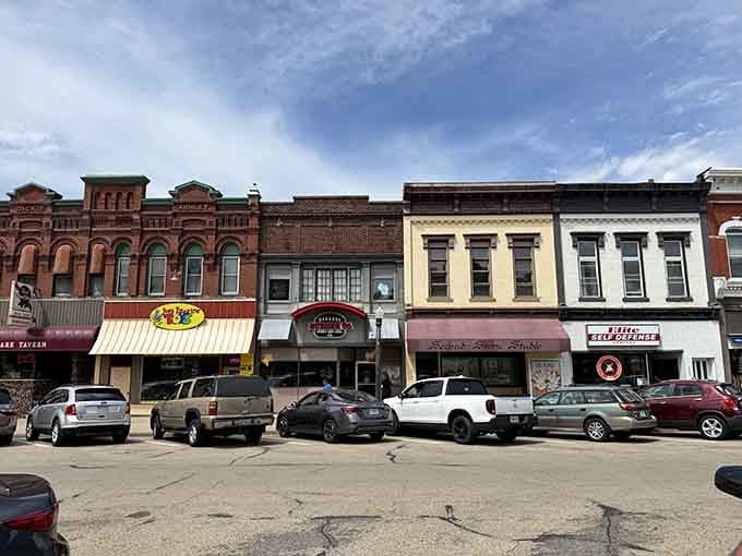 These vintage storefronts house real local businesses, not corporate chains, making downtown actually worth exploring on foot.