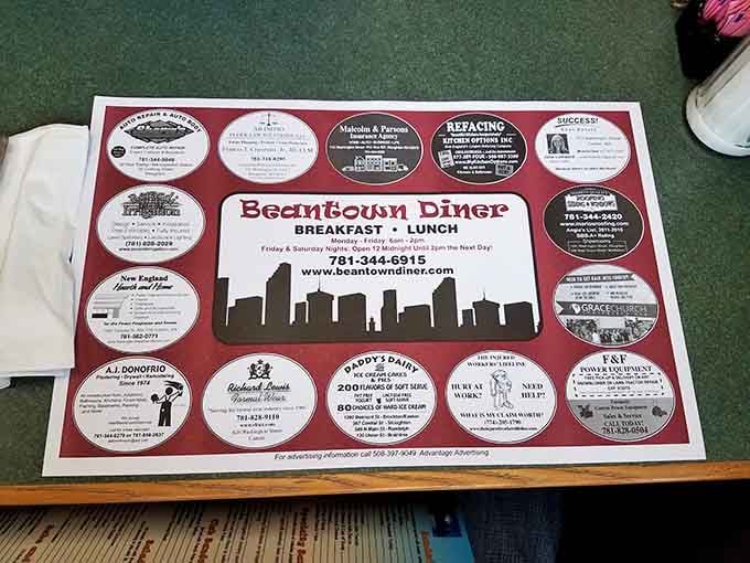 The placemat advertises local businesses, showing this diner is woven into the fabric of the Stoughton community it serves.