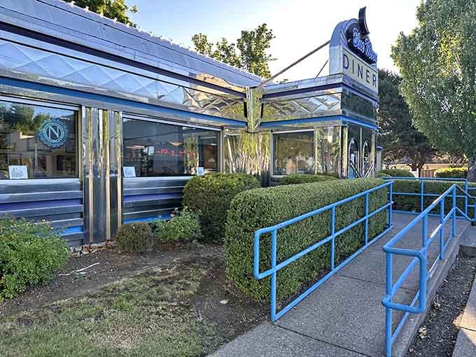 The blue railings and chrome details outside promise good things are waiting just beyond those doors ahead.