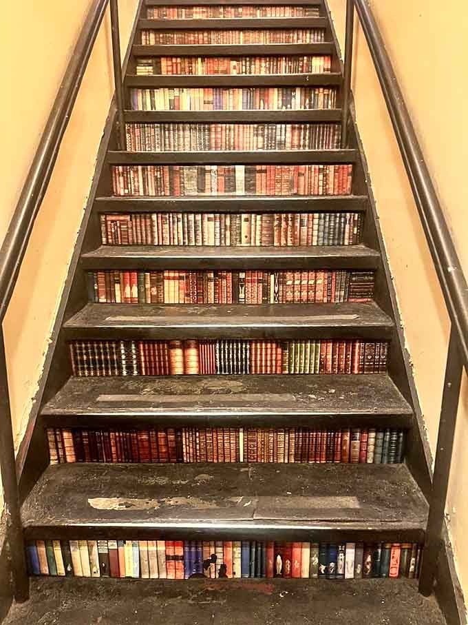 Every step up these stairs is literally a journey through classic book spines and literary history.