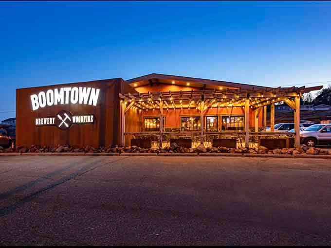 BoomTown Brewery glows with warm invitation as evening falls, promising craft beers that taste like liquid Iron Range history with modern flair.