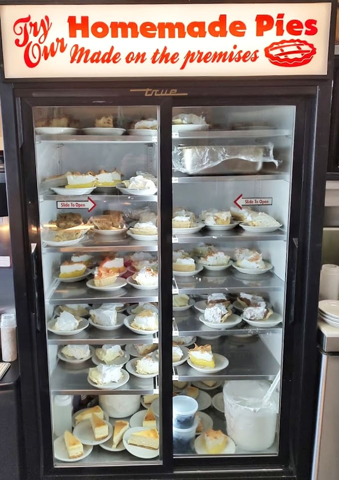 That pie case isn't just refrigeration; it's a glass-fronted gallery showcasing edible art made fresh on premises daily.