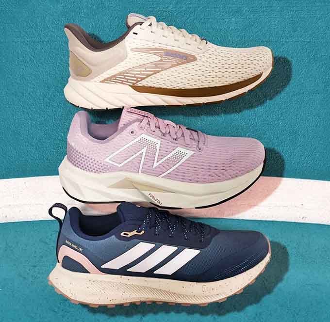 Running shoes from top brands lined up like colorful athletes, ready to make your fitness resolutions actually seem achievable.