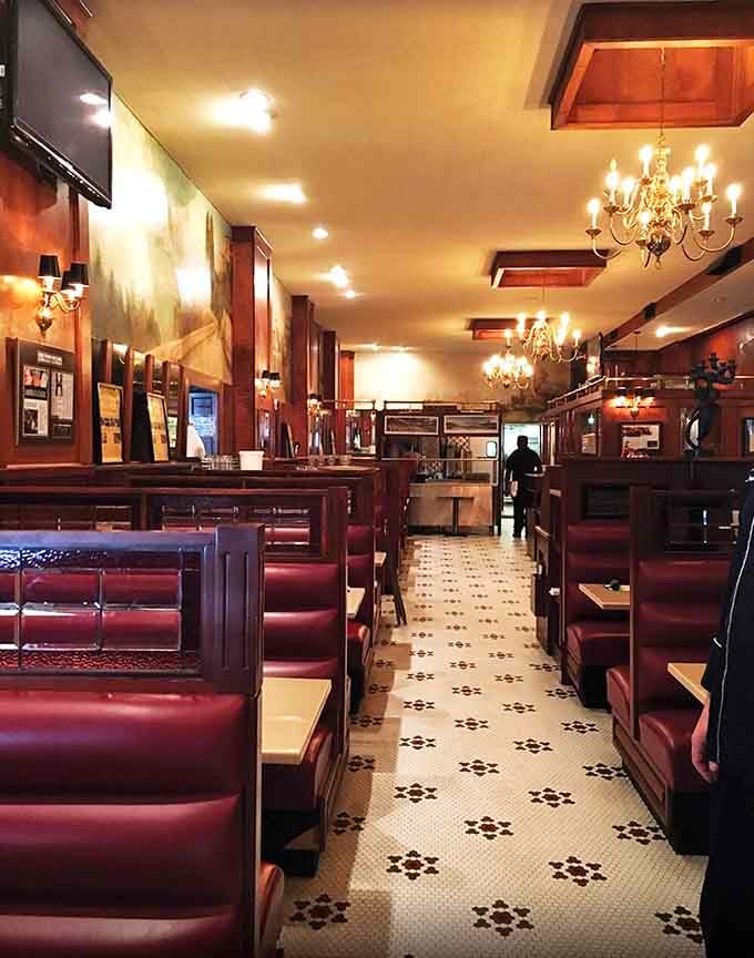 Those red leather booths have hosted more celebrations, proposals, and life moments than most wedding chapels combined.