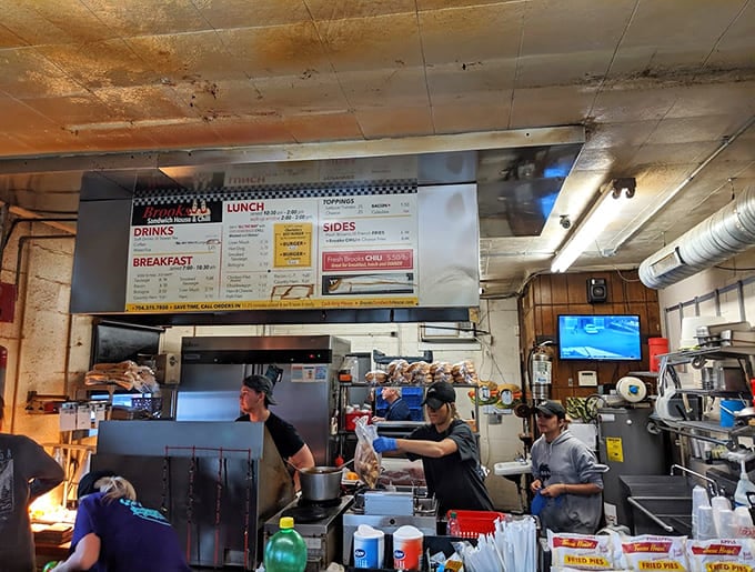 Behind the scenes, the kitchen crew works their magic with practiced efficiency and plenty of that famous chili.