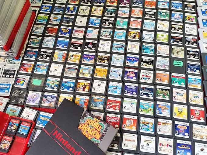 Video game cartridges organized in a rainbow of nostalgia that'll transport any child of the eighties straight back.