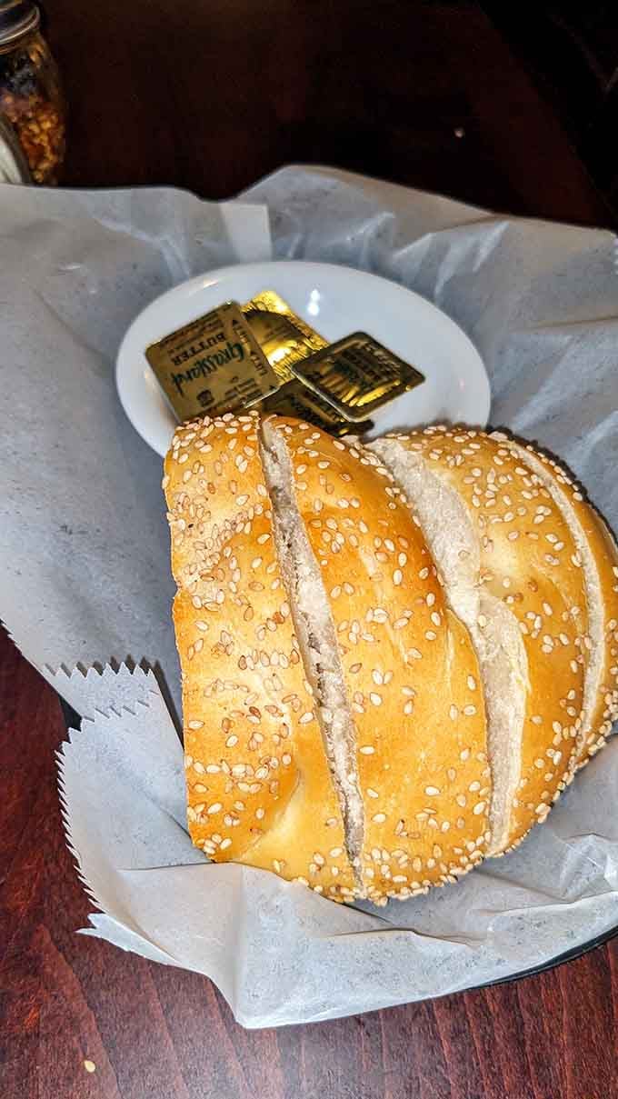 Sesame-topped bread that arrives warm at your table, ready to soak up every last drop of sauce available.