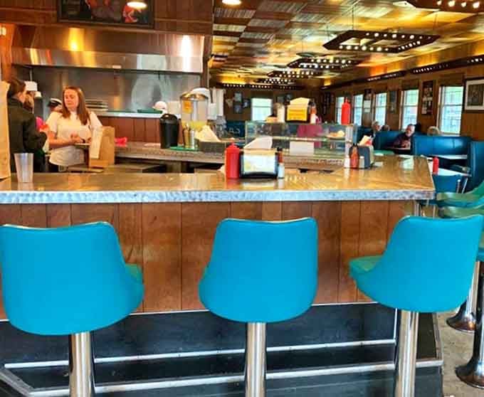 The counter where barbecue dreams come true. Notice how everyone's leaning slightly forward, anticipation making patience nearly impossible.