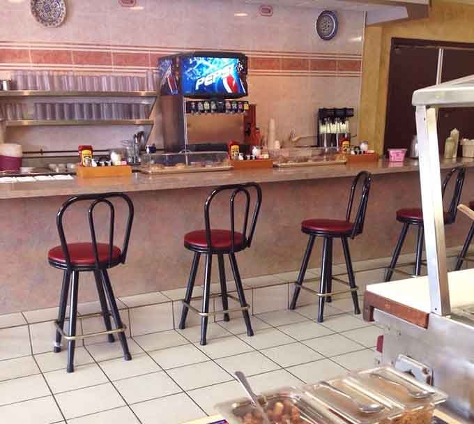 Counter seating: where solo diners become temporary members of the breakfast club and coffee refills flow freely.