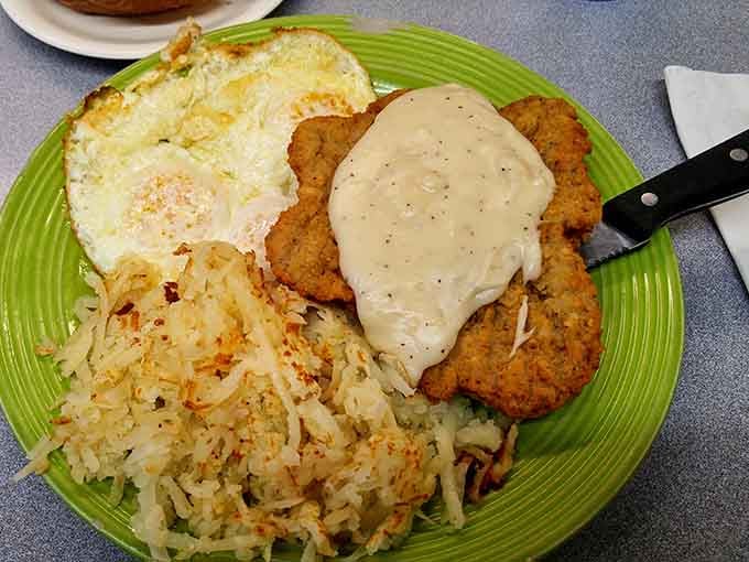Country fried steak and eggs&mdash;the breakfast equivalent of a warm hug from your favorite aunt who never understood the concept of "portion control."