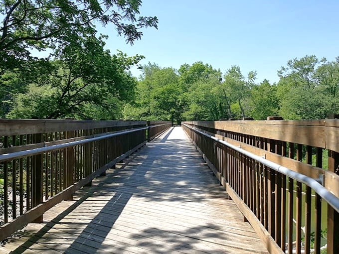 This bridge over Sugar Creek invites peaceful walks where your biggest decision is which direction to stroll first.