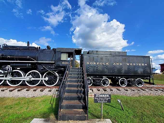 The majestic Norfolk and Western steam engine No. 606 commands respect with its massive wheels and tender.