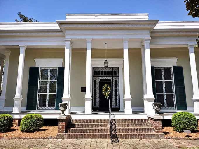 The Curlee House's stately white columns and meticulous landscaping showcase antebellum elegance. Southern grandeur that doesn't need to raise its voice to be heard.