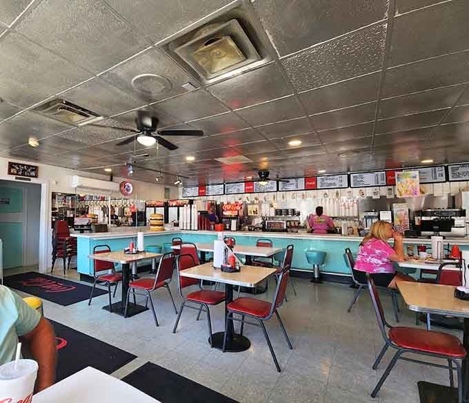 The metallic ceiling tiles and booth seating create an atmosphere where Elvis would feel right at home today.