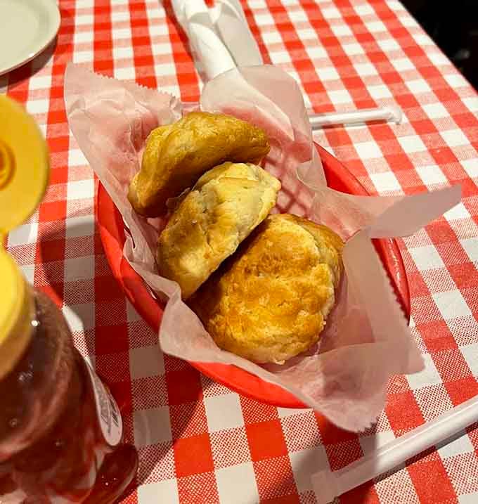 Fresh-baked biscuits arriving warm in a basket might be the best opening act in restaurant history.